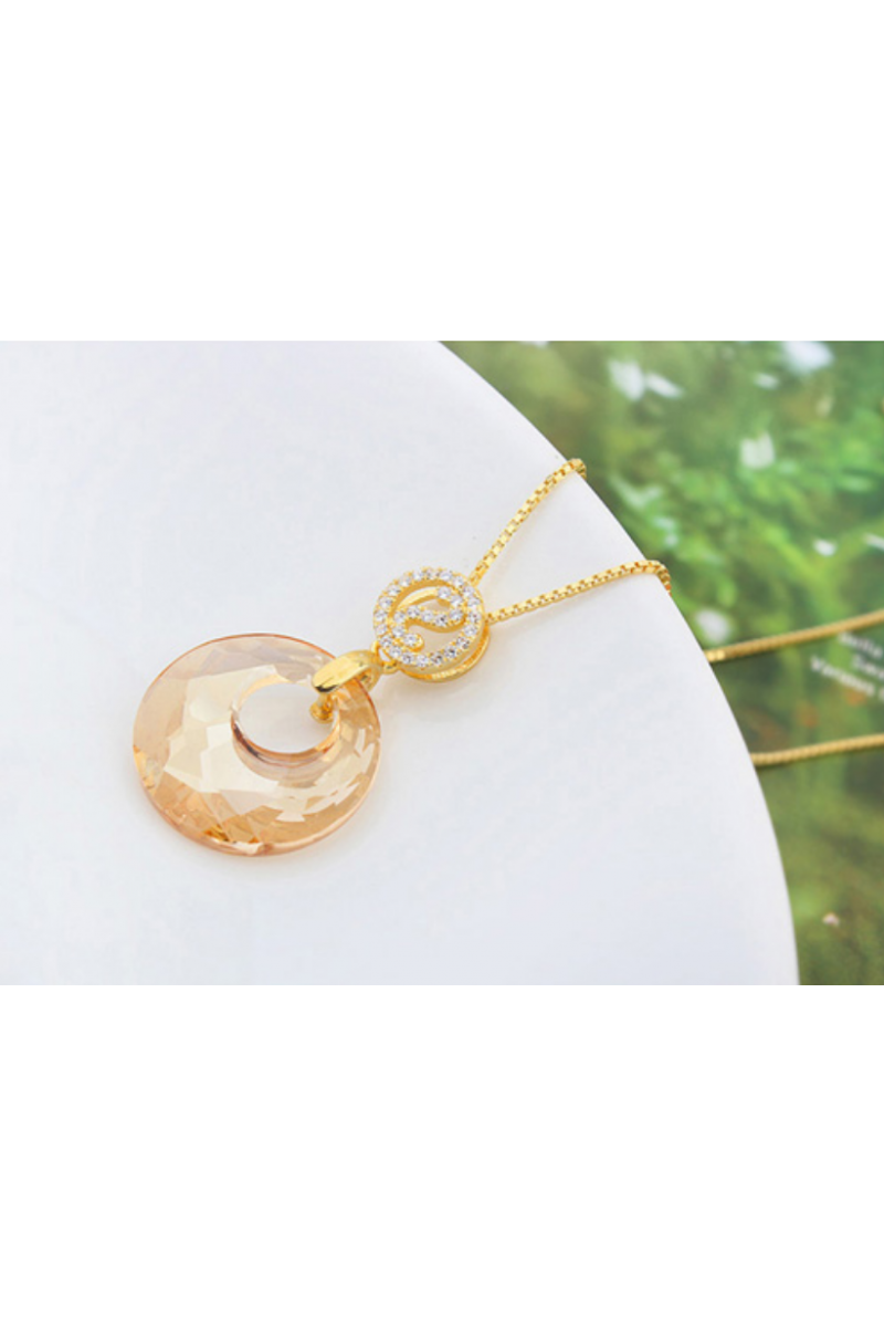 Collier cercle ajourée pierre cristal orange avec chaîne dorée - Ref ...